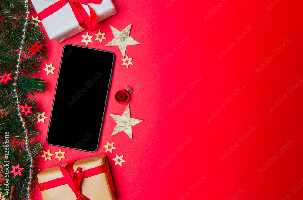 Smartphone in Christmas red background with tree, gift and decor Stock ...