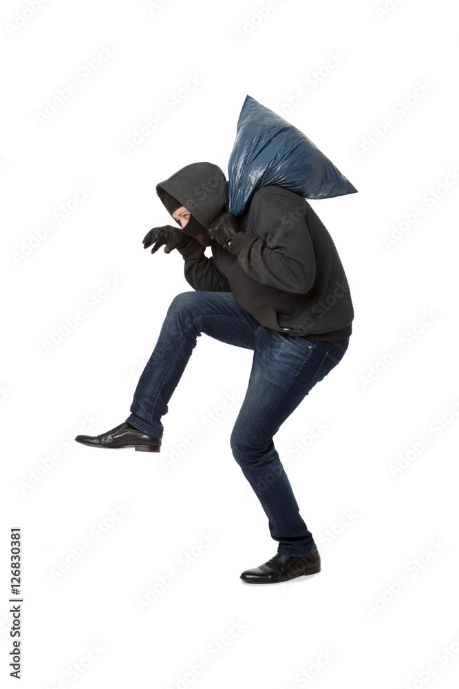 Foto Stock Robber with bag on shoulder | Adobe Stock