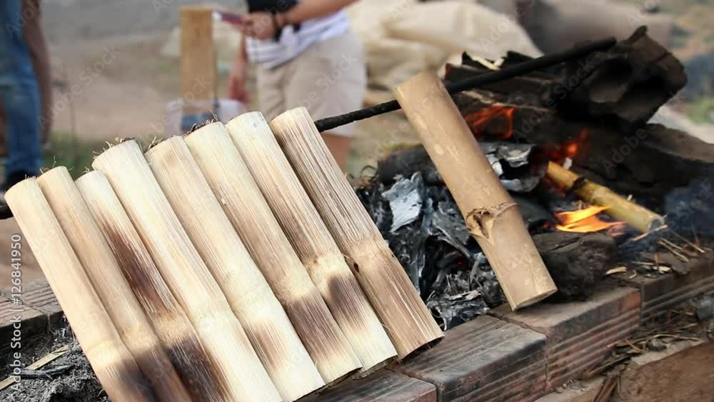 Cambodia Khmer Krolan bamboo sticky rice cooking Stock ビデオ | Adobe Stock