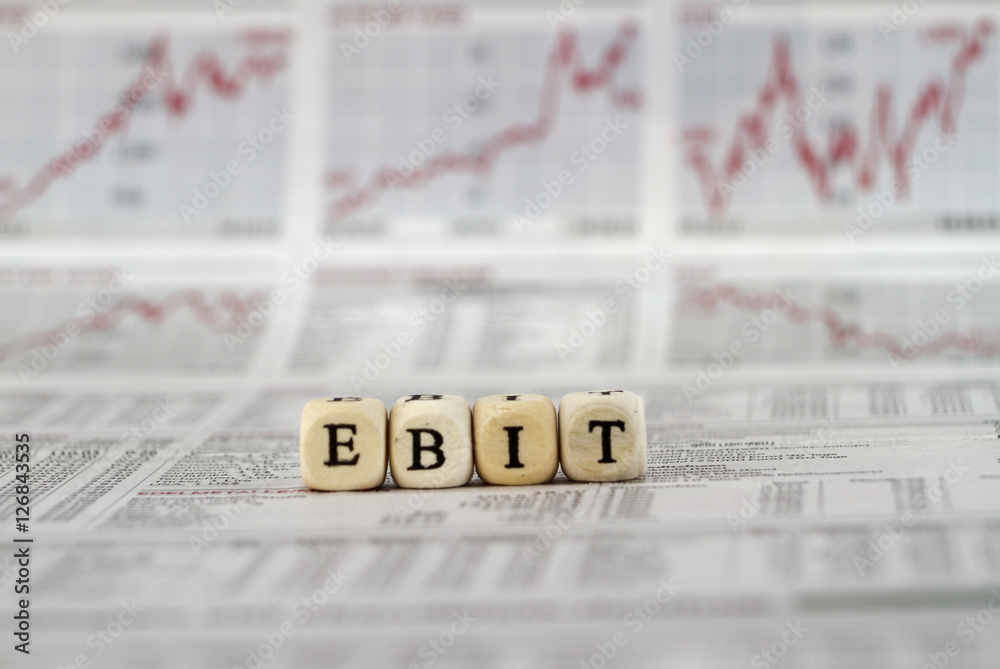 EBIT word built with letter cubes on newspaper background Stock Photo ...