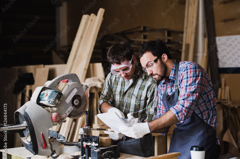 angry boss and worker together in a carpenter's workshop Stock Photo ...