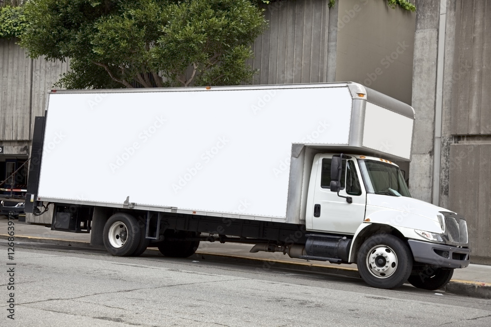 White Moving Van Parked on Urban Street Stock-Foto | Adobe Stock