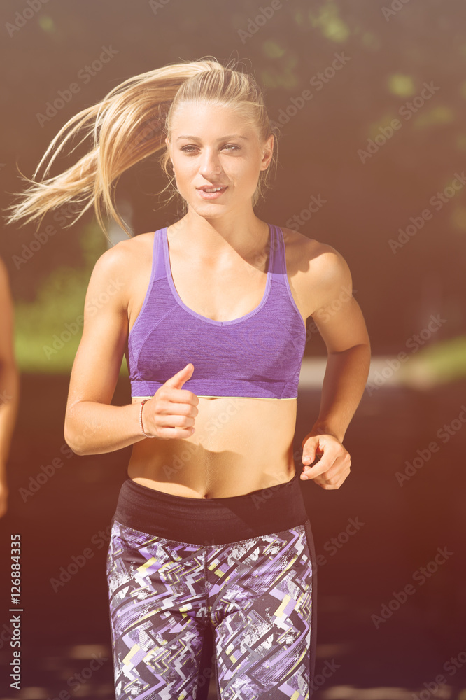 Runner athlete running at park. woman fitness jogging workout wellness ...
