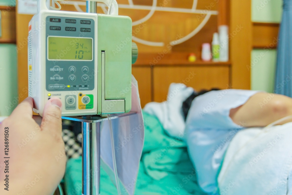 Illness asian old woman lying on sickbed in hospital with infusion pump ...
