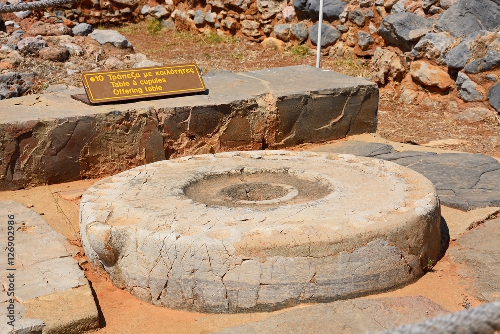Ancient offering table at the Minoan Malia ruins archaeological site ...