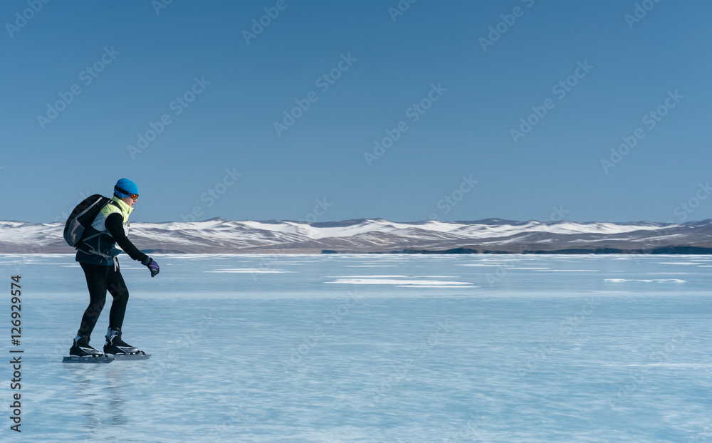 Tourists travel to Norway hiking ice skating on the frozen lake ...