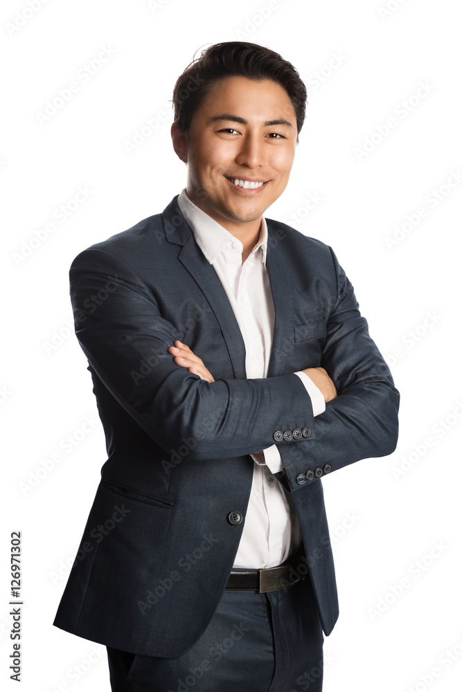 A well dressed businessman in a blue suit and white shirt, standing ...