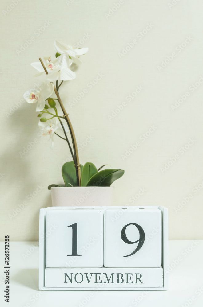 Closeup white wooden calendar with black 19 november word with white ...