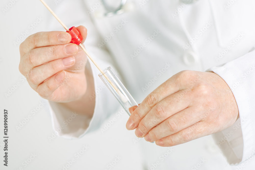 Female gynecologist holding disposable cervical sample swab Stock Photo ...