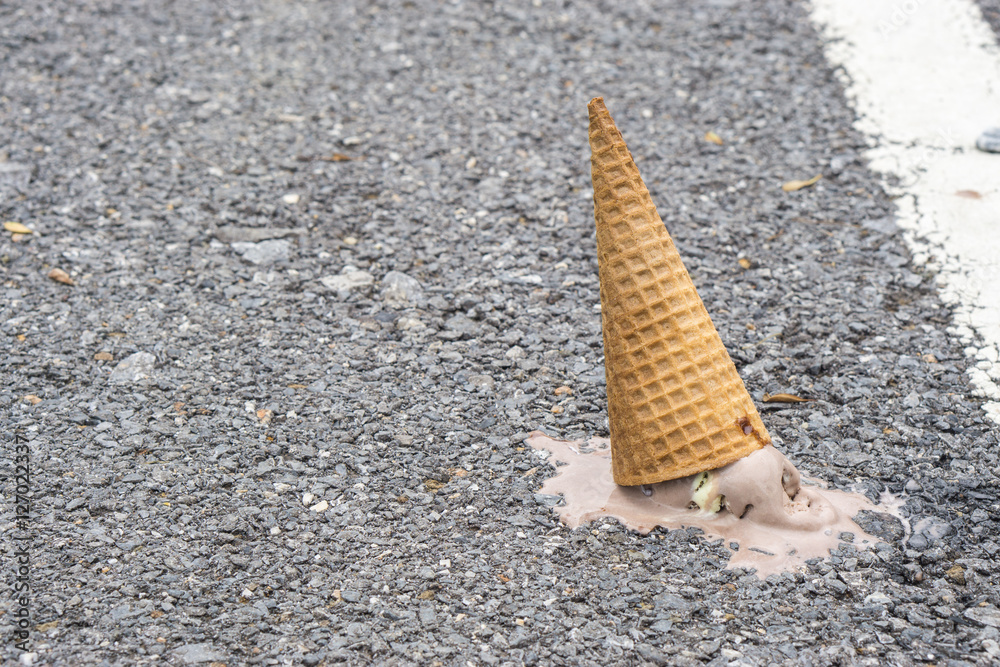 Ice cream on the ground. (selective focus) , ice cream cone dropped on ...