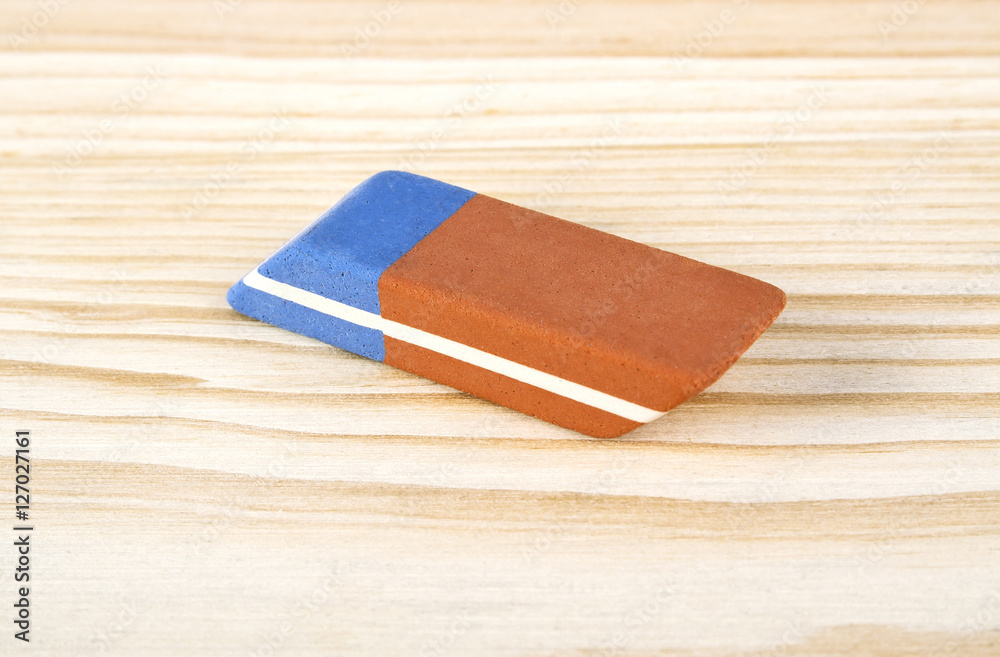 Eraser on wooden background Stock-Foto | Adobe Stock