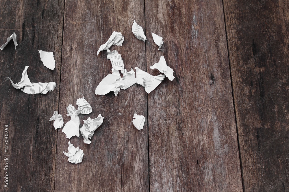 White paper sheet, The paper note rip Pieces and crumpled on wooden ...