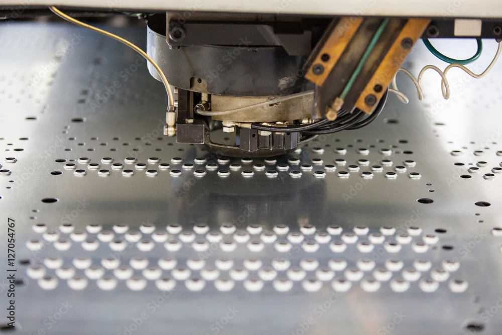 Rotation CNC Punching & Nibbling Machine in action. Metal perforating ...