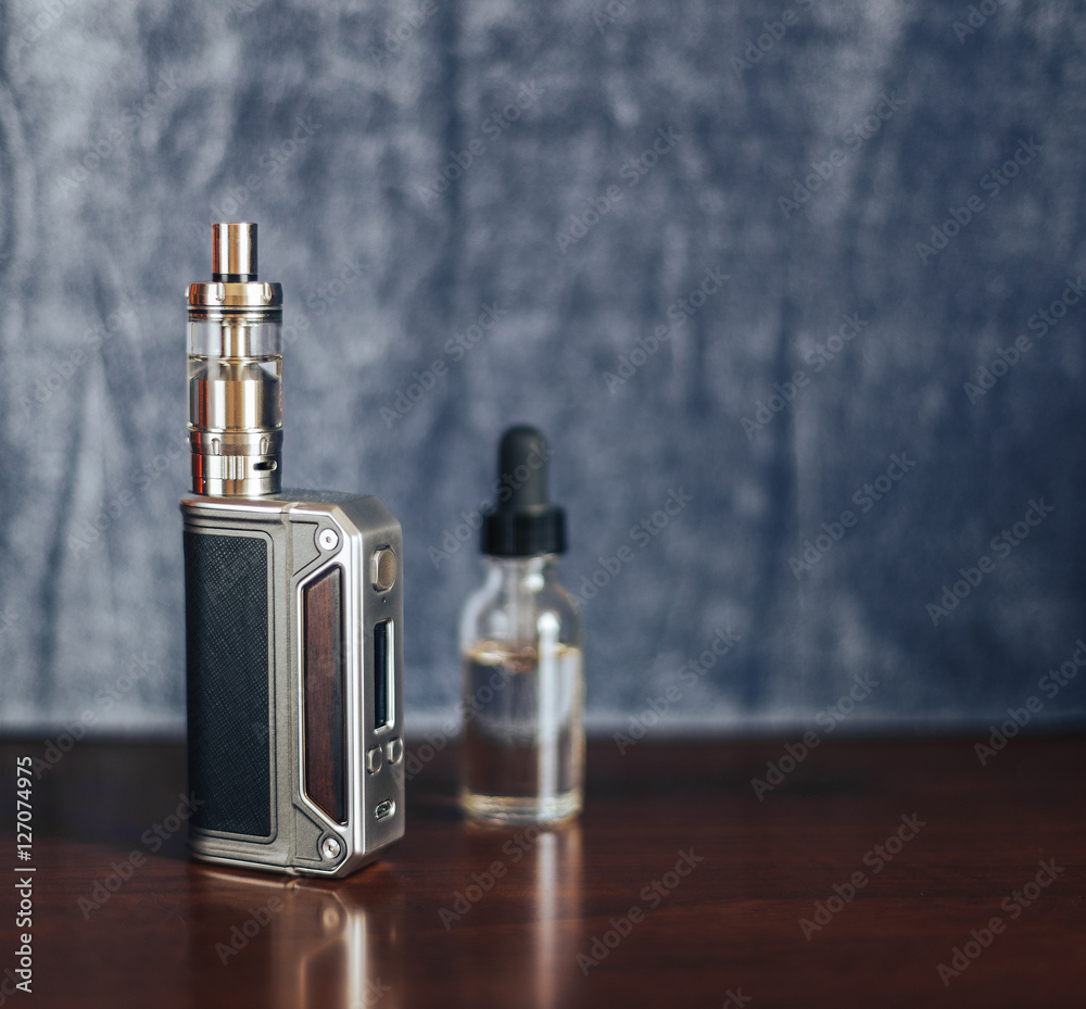 Vape devices, E-cigarette for vaping, liquid in the bottle and mobile ...