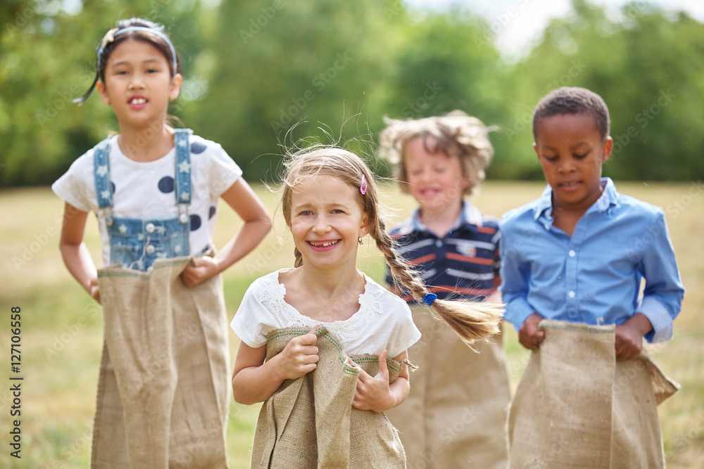 Children at sack race Stock Photo | Adobe Stock