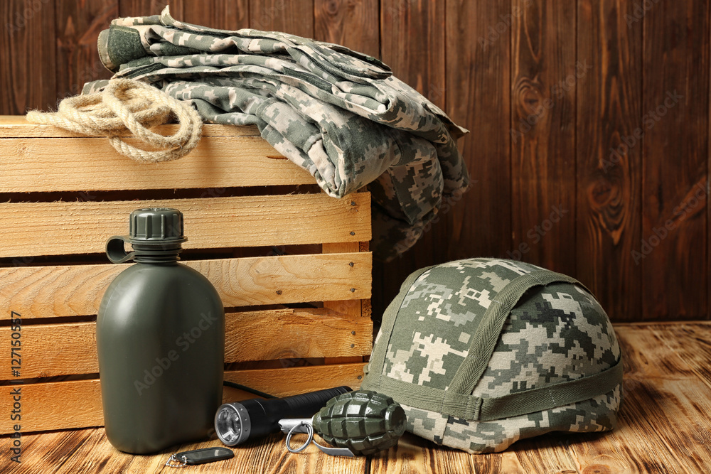 Set of military outfit on wooden background, close up Stock Photo ...