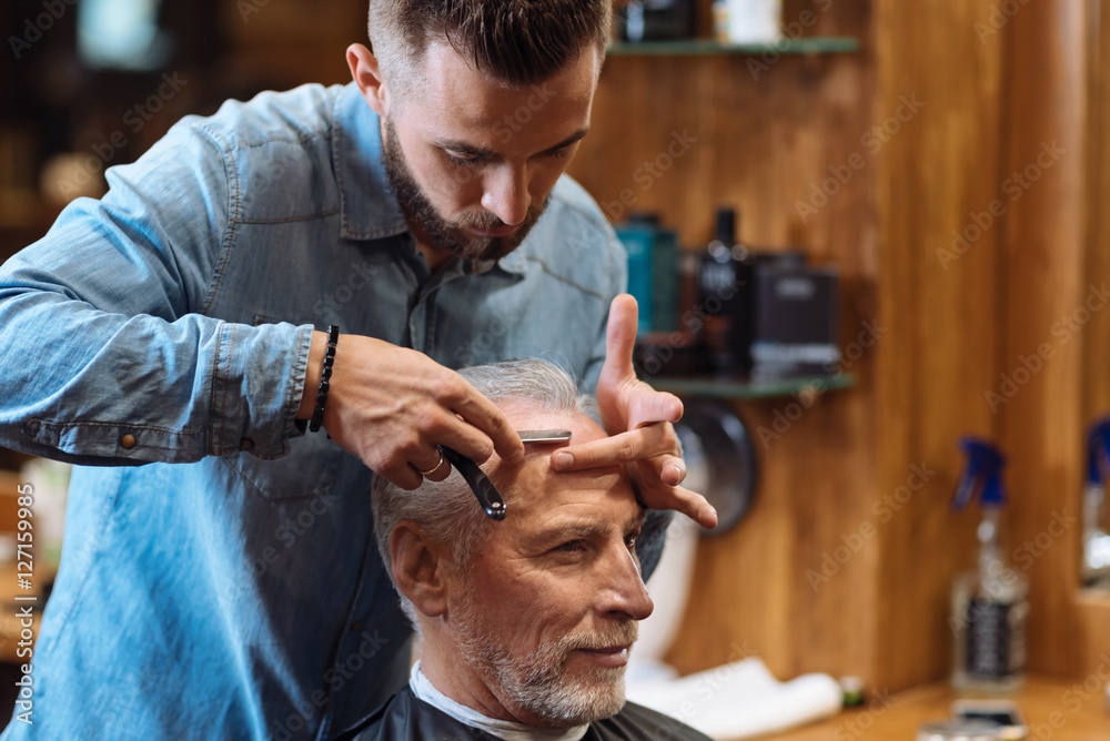 Barber cutting forehead hair with special knife Stock Photo | Adobe Stock