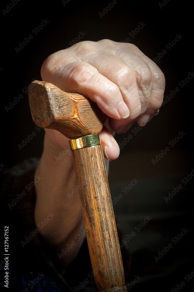 walking stick in hand of senior woman Stock Photo | Adobe Stock