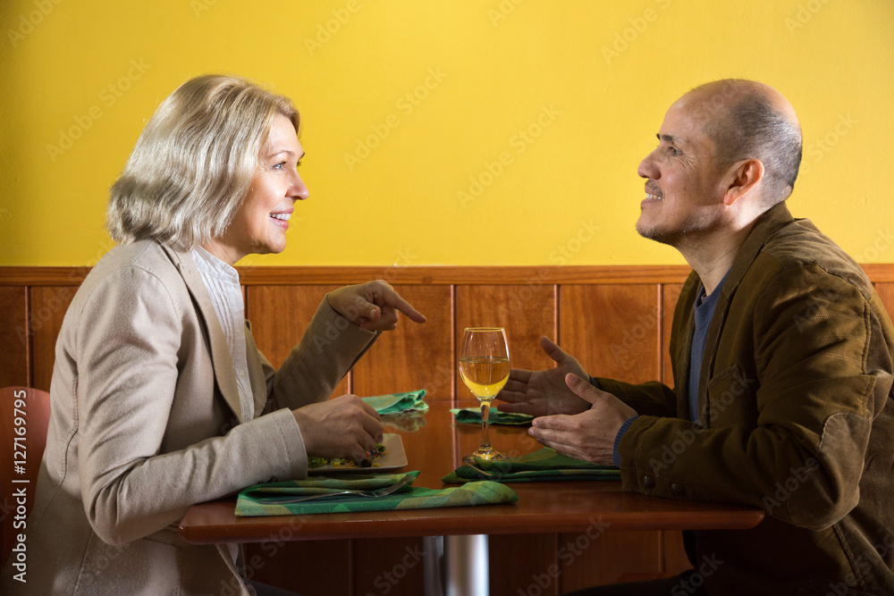 man and woman sitting across from each other at a restaurant Stock ...