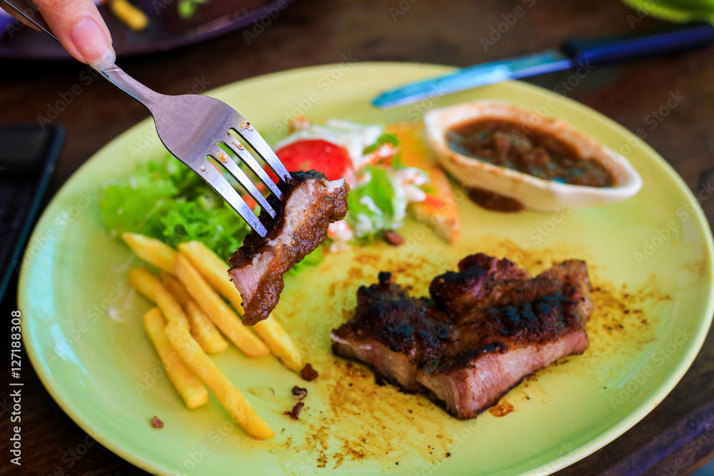 Top view the food steak , Rustic grilled beefsteak with french fries ...