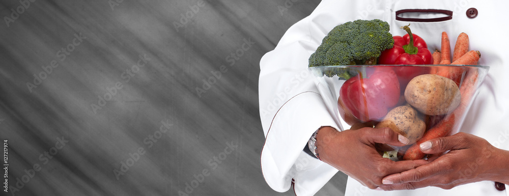 Chef hands with vegetables. Stock Photo | Adobe Stock