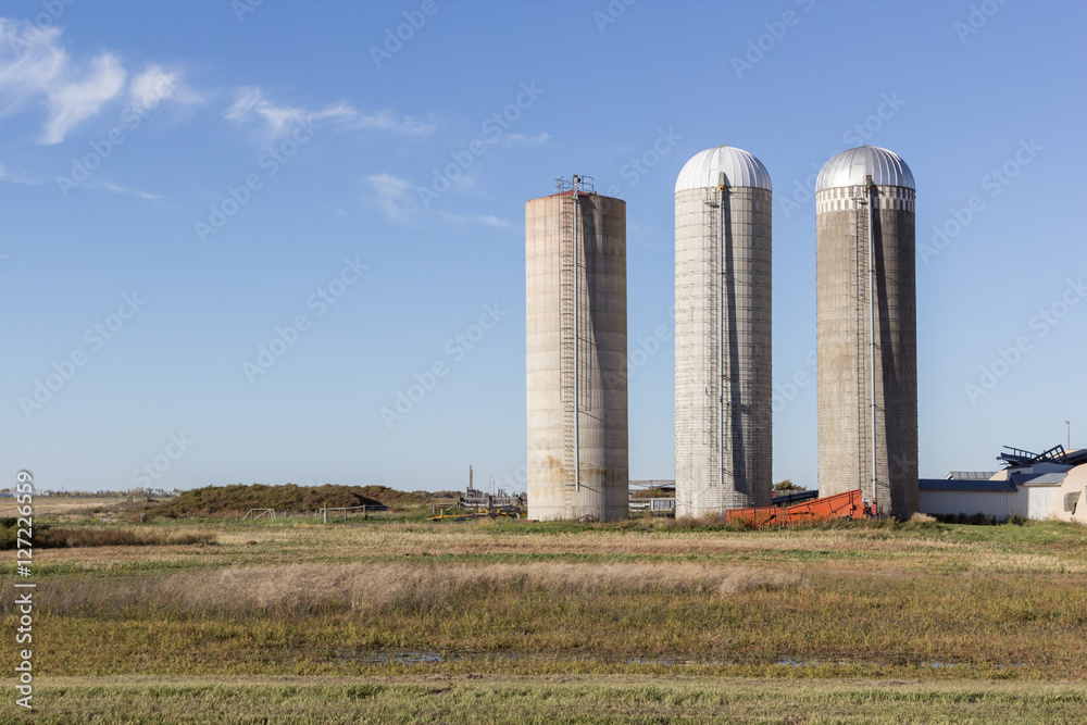 three tall silos Stock Photo | Adobe Stock
