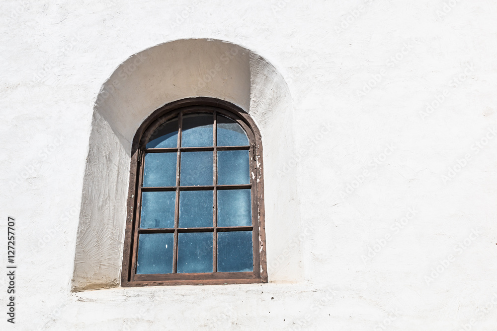 Spanish revival style arched window on white stucco wall. Stock Photo ...