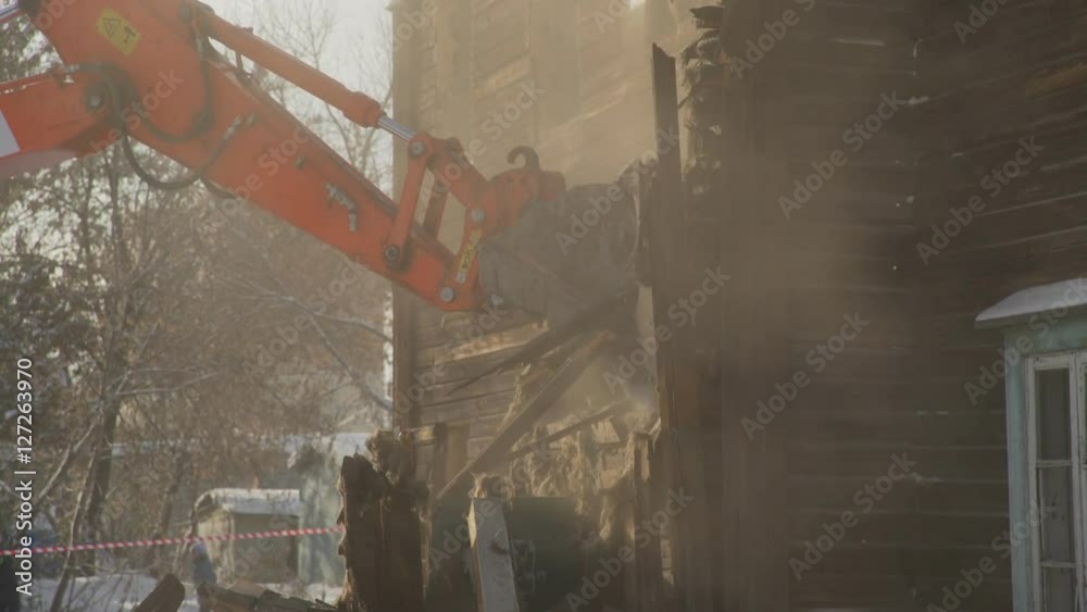 Close-up of rundown building. Bucket breaks the walls and floors of the ...