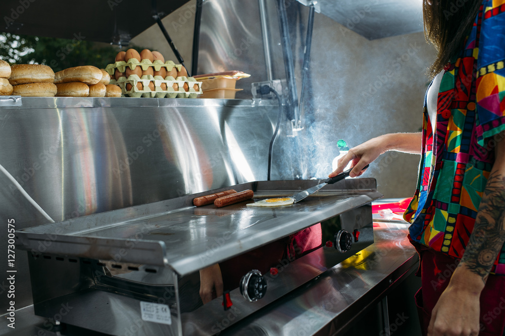 Crop female cooking On grill Stock Photo | Adobe Stock