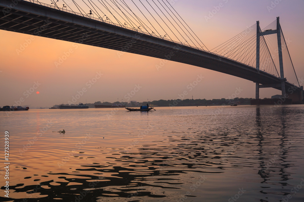 Vidyasagar Setu (bridge) on river Hooghly at twilight. The Hooghly ...