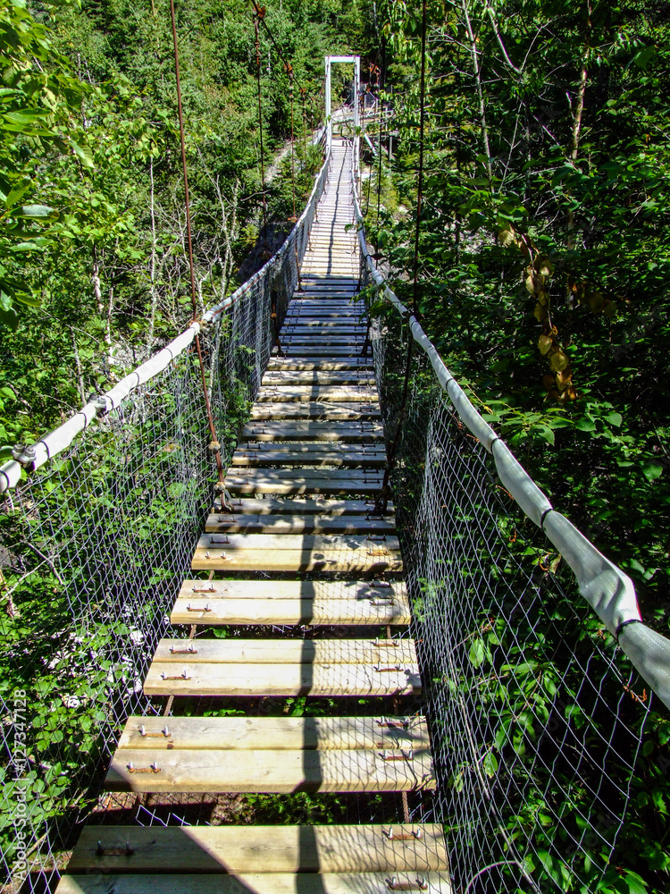 wooden bridge over deep gorge Stock Photo | Adobe Stock