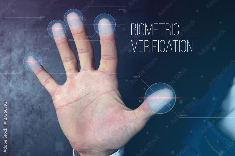 Man passing biometric identification with fingerprint scanner foto de ...