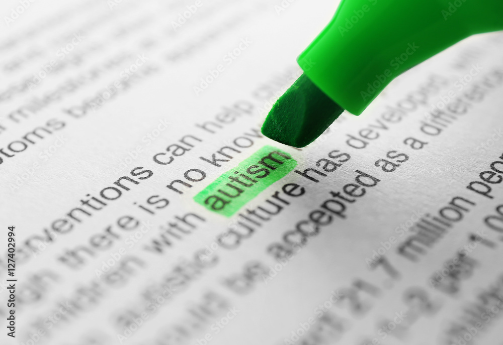 Newspaper article and word AUTISM underlined with green marker Stock ...