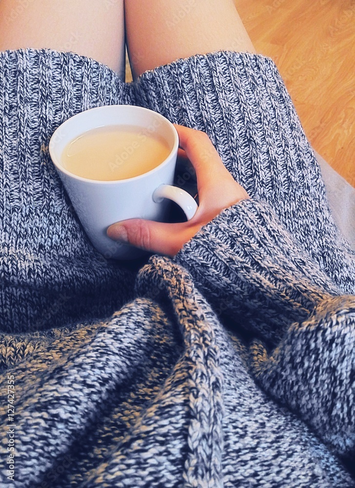 A girl holding a cup of coffee in hand Stock Photo | Adobe Stock