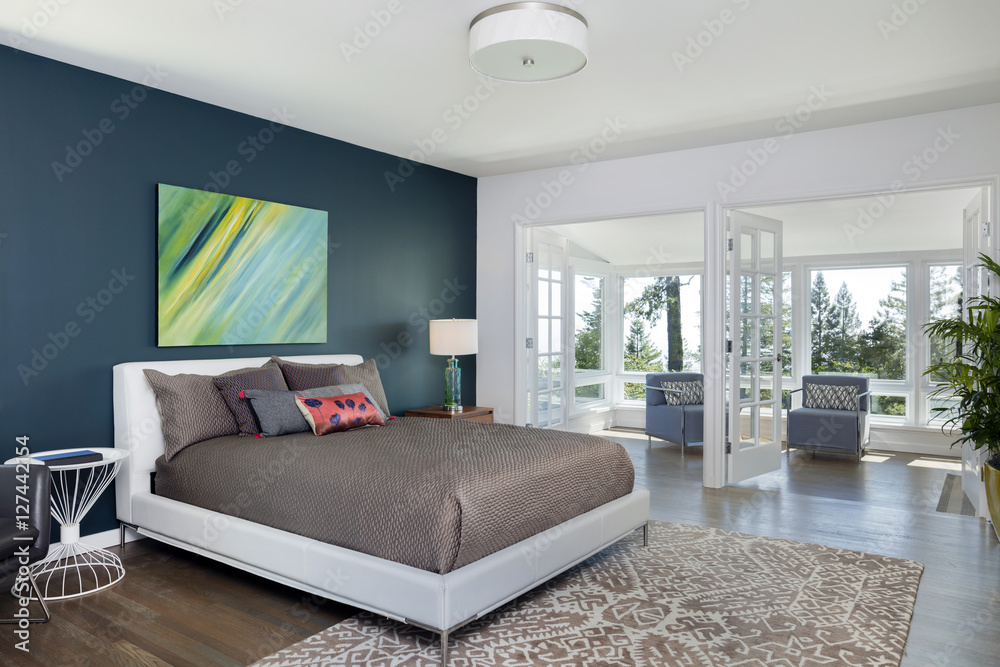 Open spacious bedroom with modern stylish furniture and double french ...