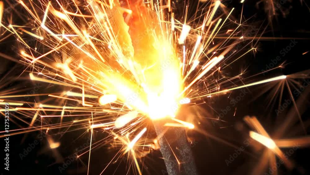 Firework sparkler burning isolated from top to bottom in macro shot ...