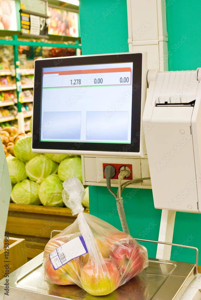 electronic scales in the supermarket vegetable and fruit department ...