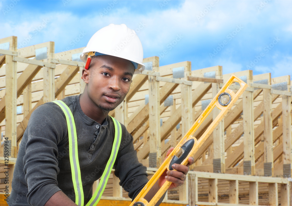 construction worker on site holding level with white helmet Stock Photo ...