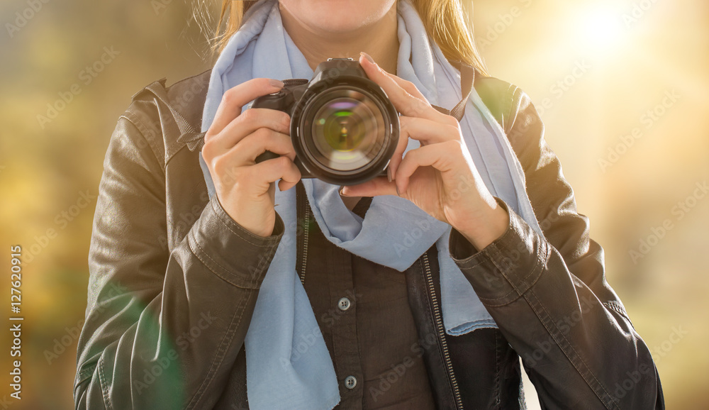 Portrait of a photographer covering her face with camera. Stock-Foto ...