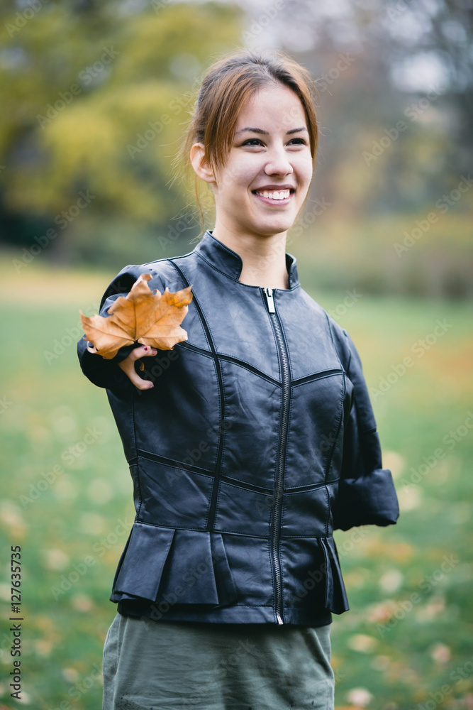 Portrait of beautiful smiling invalid young woman born without upper ...