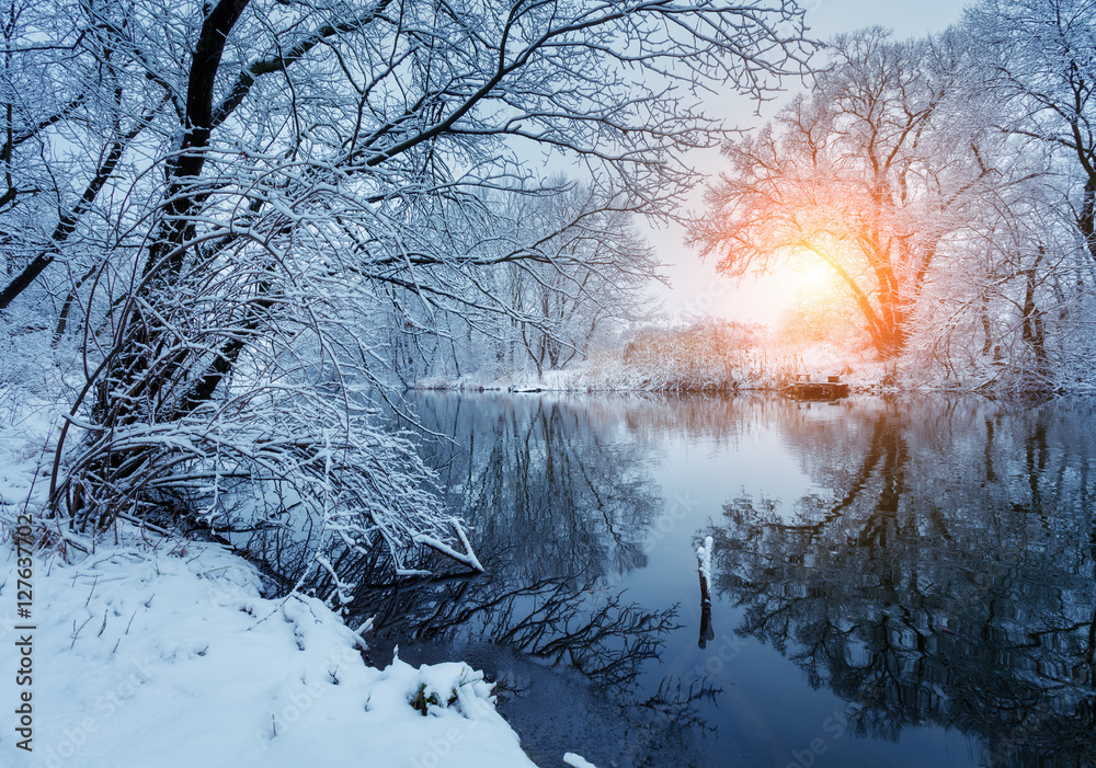 Beautiful winter in forest on the river at sunset. Winter landscape ...