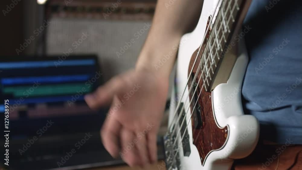 Bassist playing bass guitar slap technique and record session with ...