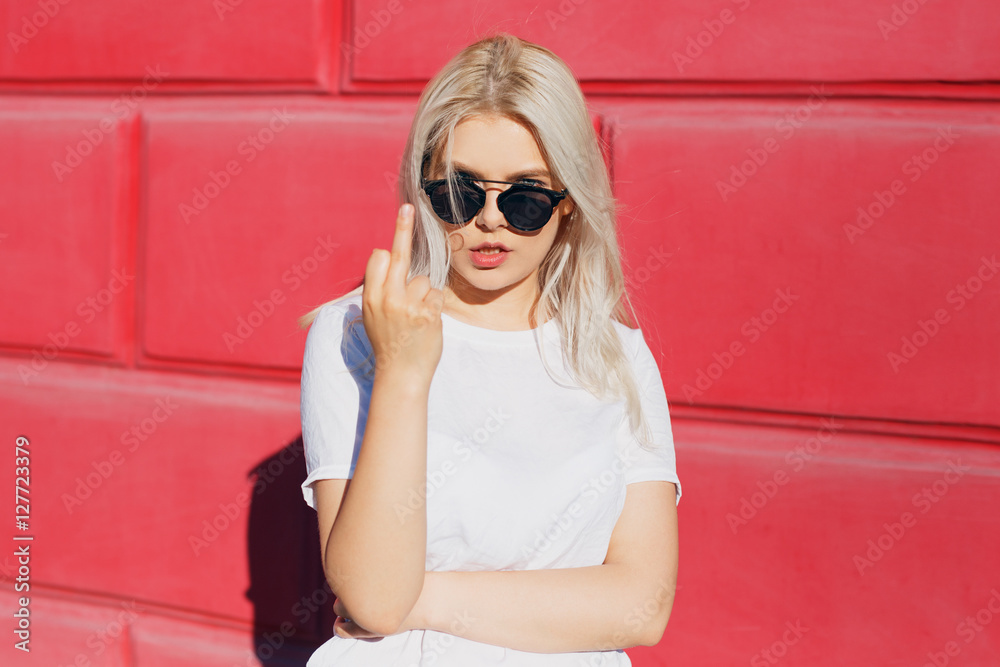 girl showing middle finger you gesture foto de Stock | Adobe Stock