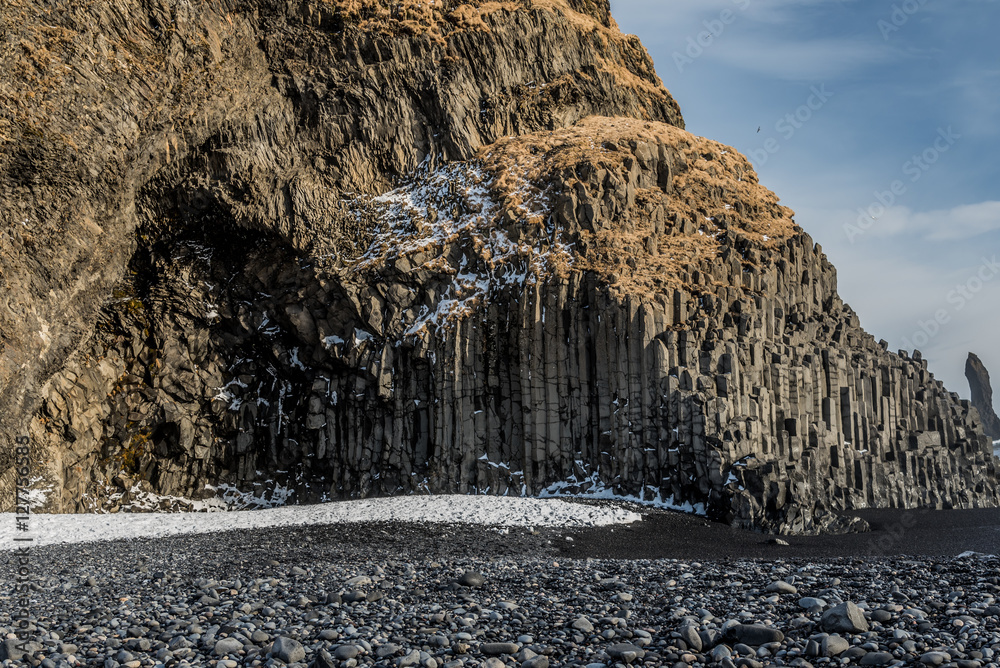 Reynisdranger, sea stacks under the mountain Reynisfjall Stock Photo ...