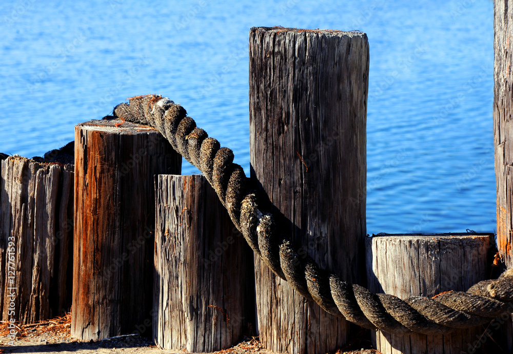 Dock Pilings with Rope Stock Photo | Adobe Stock