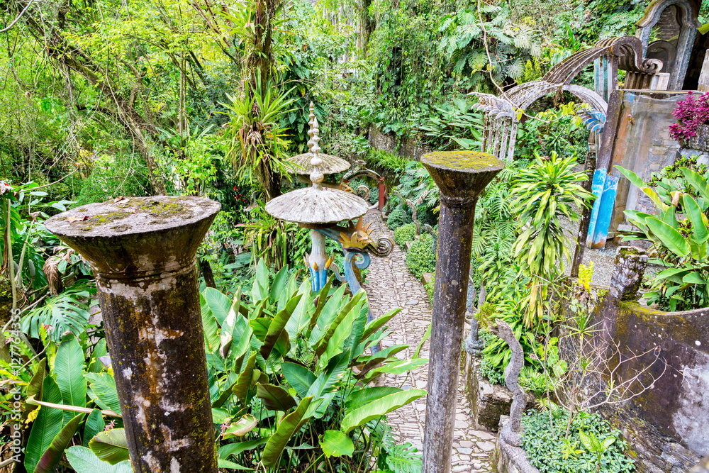 Old concrete monuments decaying in a cloud forest in Mexico. These ...