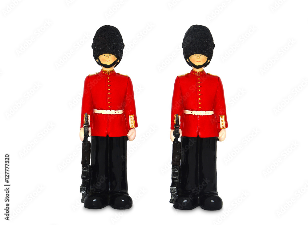 two Queen's guard statue in traditional uniform with weapon, British ...