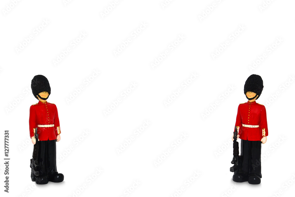 two Queen's guard statue in traditional uniform with weapon, British ...