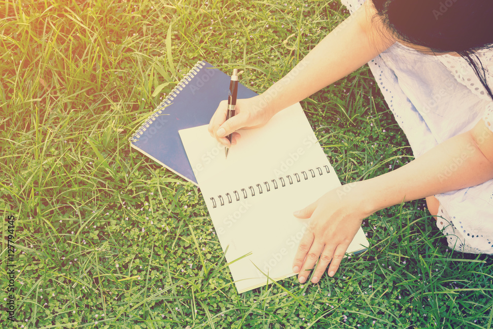 Women write books in the garden Stock Photo | Adobe Stock