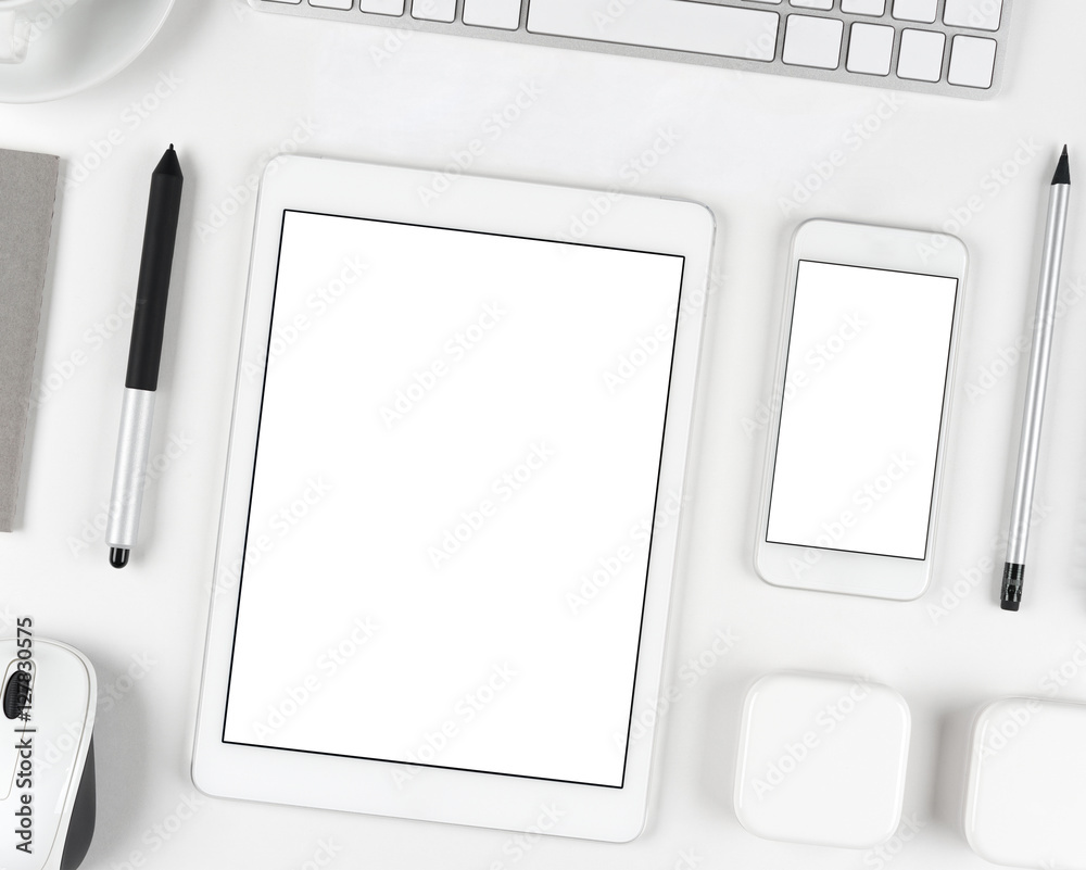 Top view: Keyboard tablet and smartphone on white table background with ...